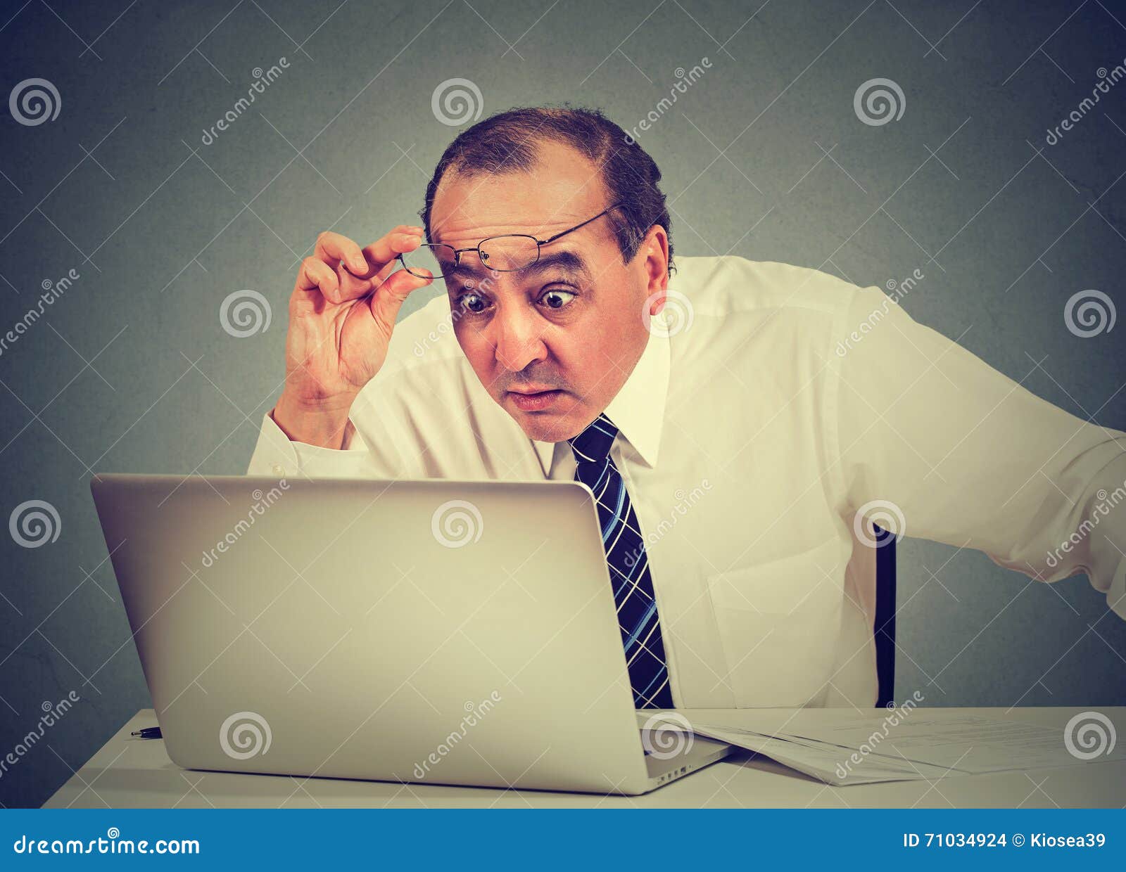 Shocked Man Reading Message on Computer in Office Stock Photo - Image ...