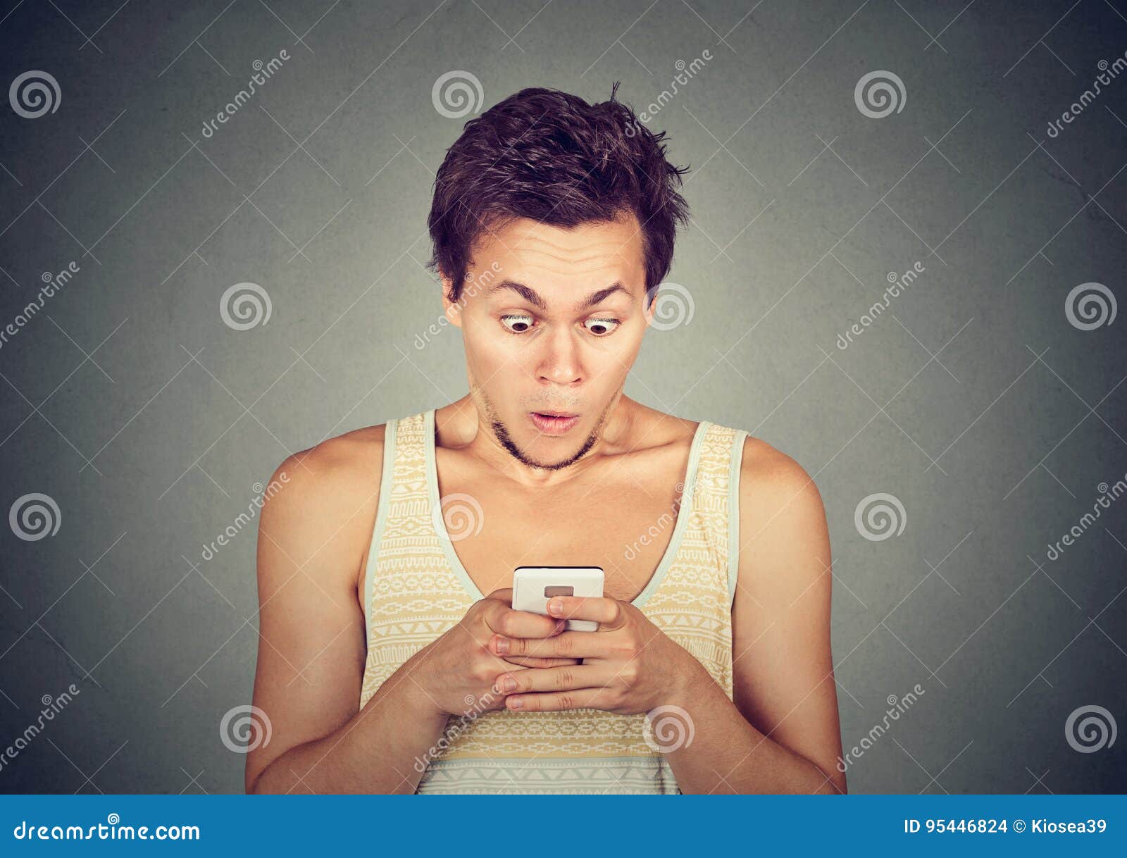 Shocked Man Reading Text Message or News on Mobile Phone Stock Photo ...