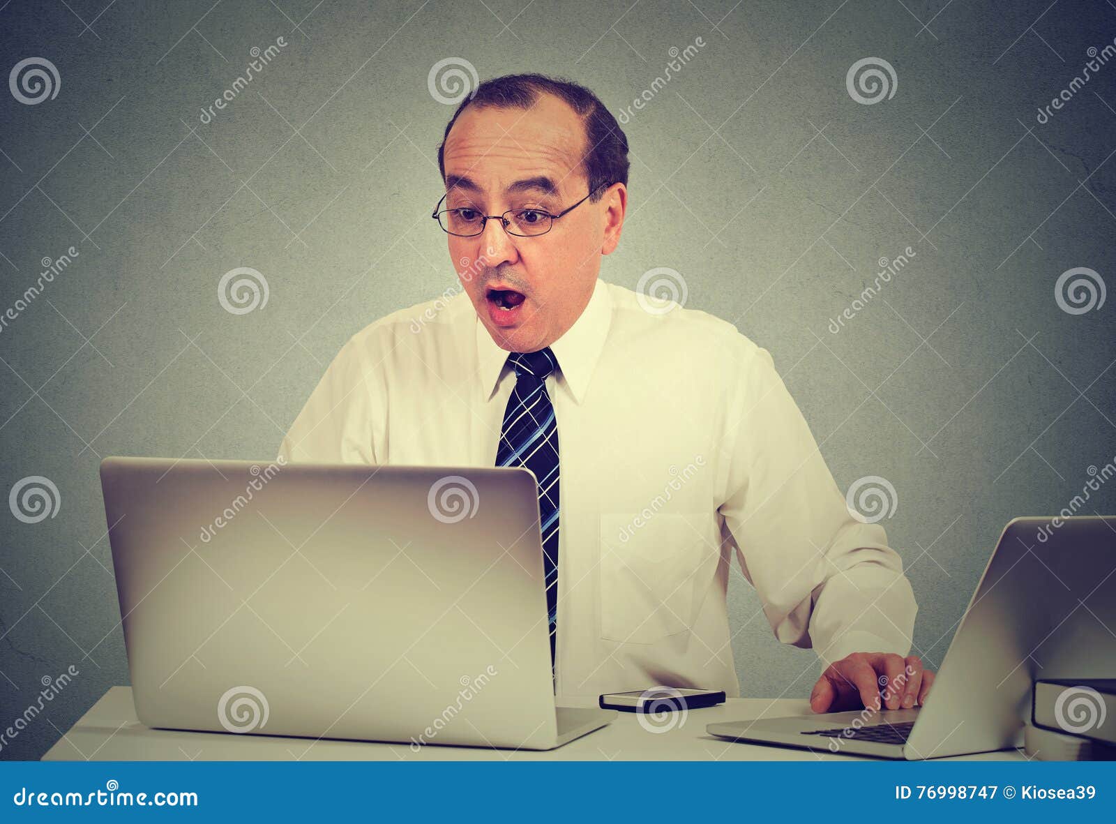Shocked Man Sitting in Front of Laptop Computer Stock Image - Image of ...