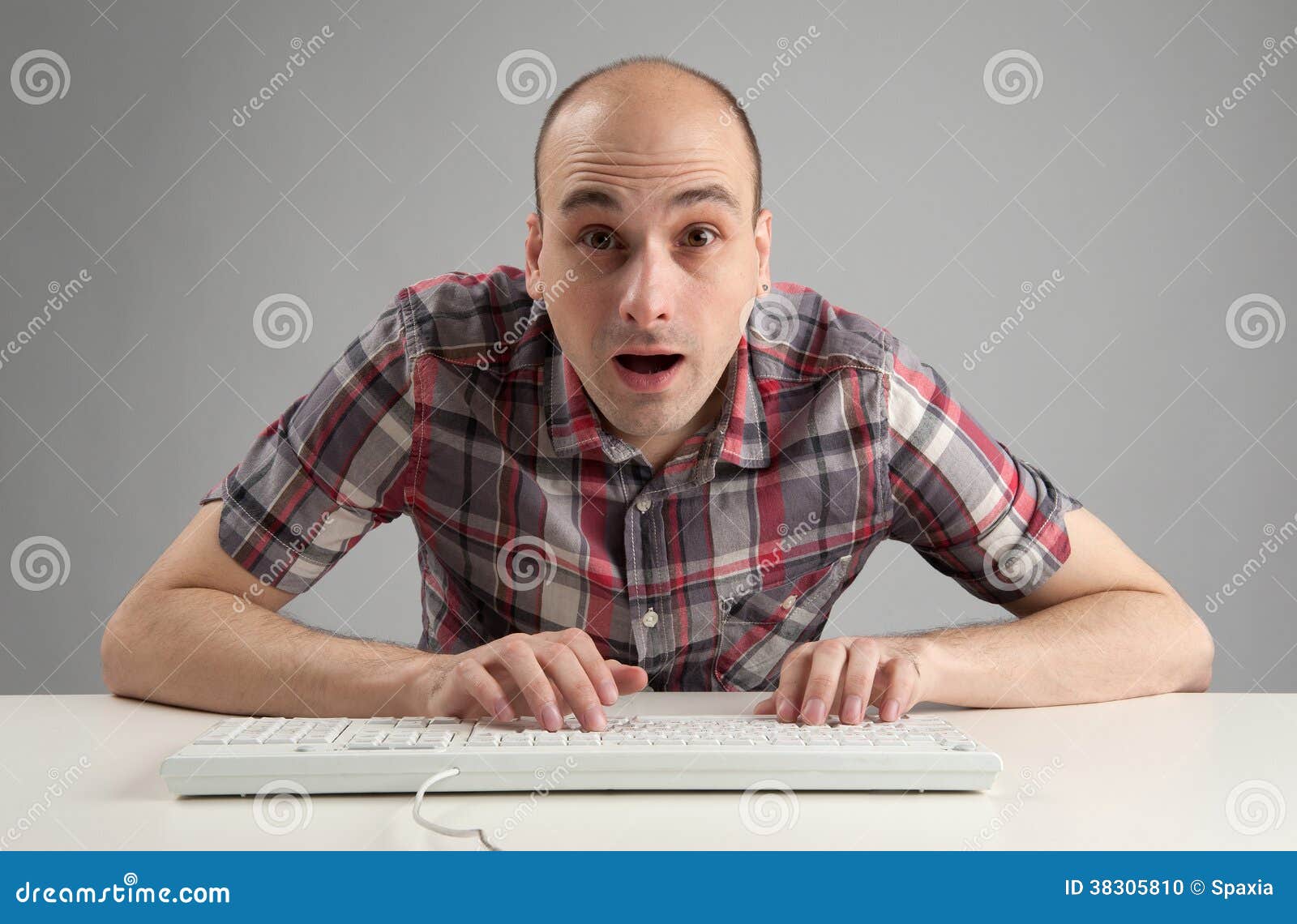 Shocked man using keyboard stock photo. Image of student - 38305810