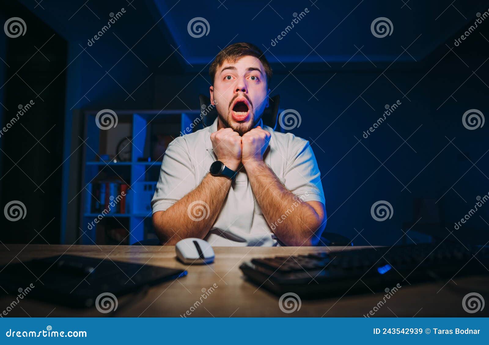 Shocked Man Working at Night on Computer at Room in Blue Light and ...
