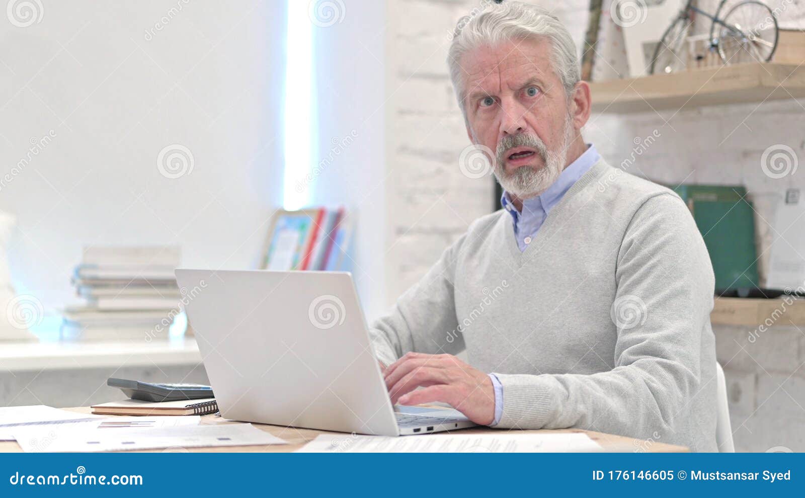Shocked Senior Old Man Wondering while Sitting at Workplace Stock Image ...