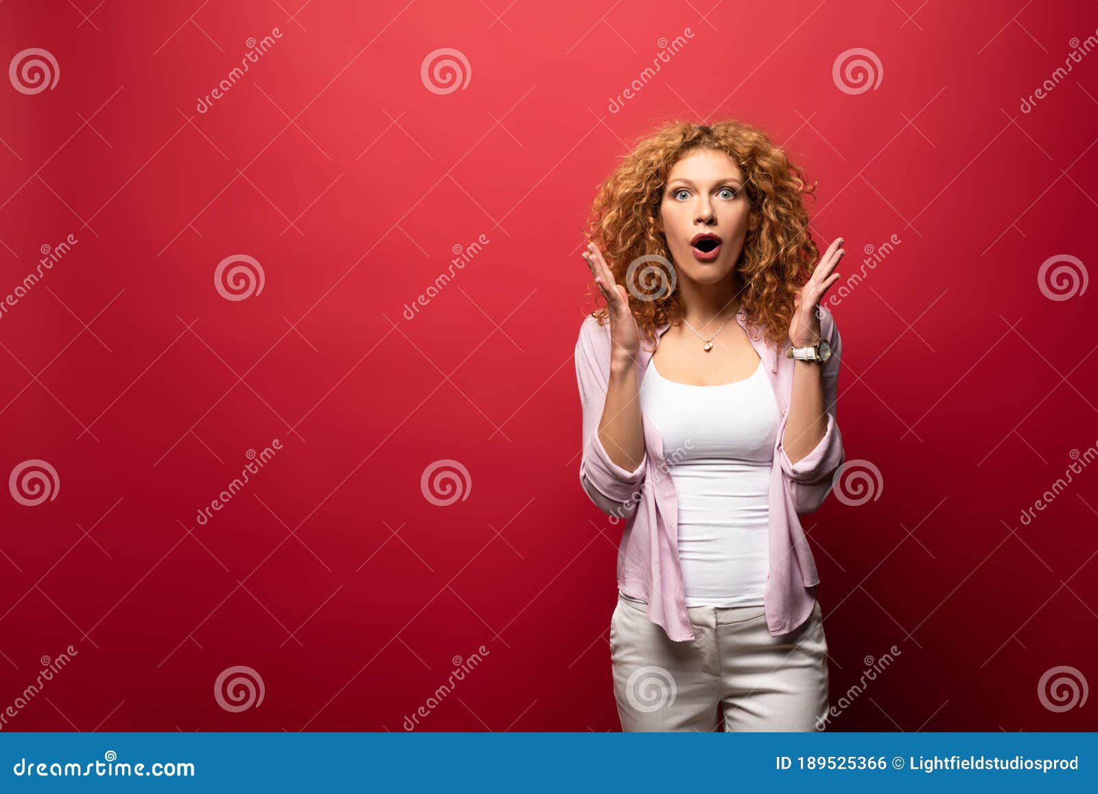Shocked Redhead Woman Gesturing Isolated on Red Stock Photo - Image of ...