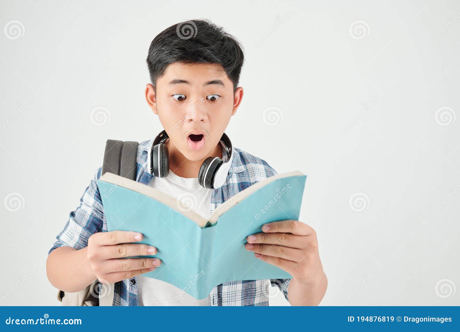 Shocked Schoolboy Reading Book Stock Image - Image of child, female ...