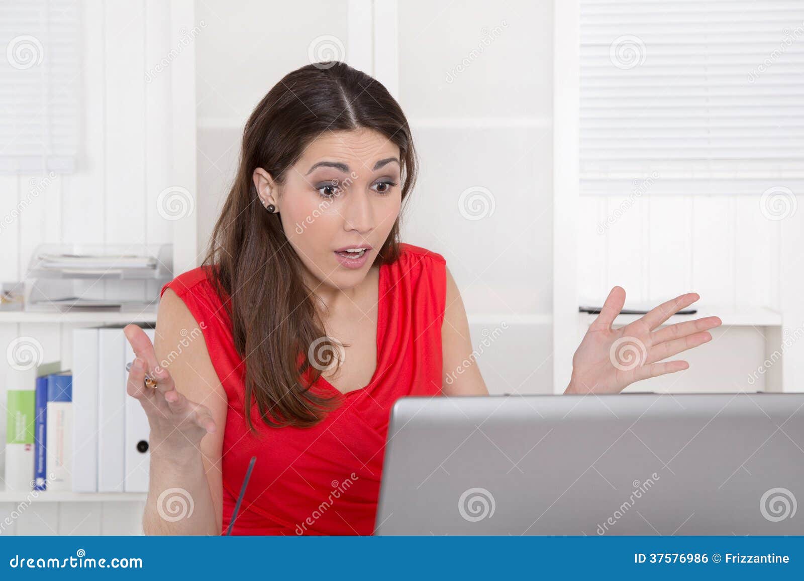Shocked Secretary in Front of Her Computer at Office. Stock Photo ...