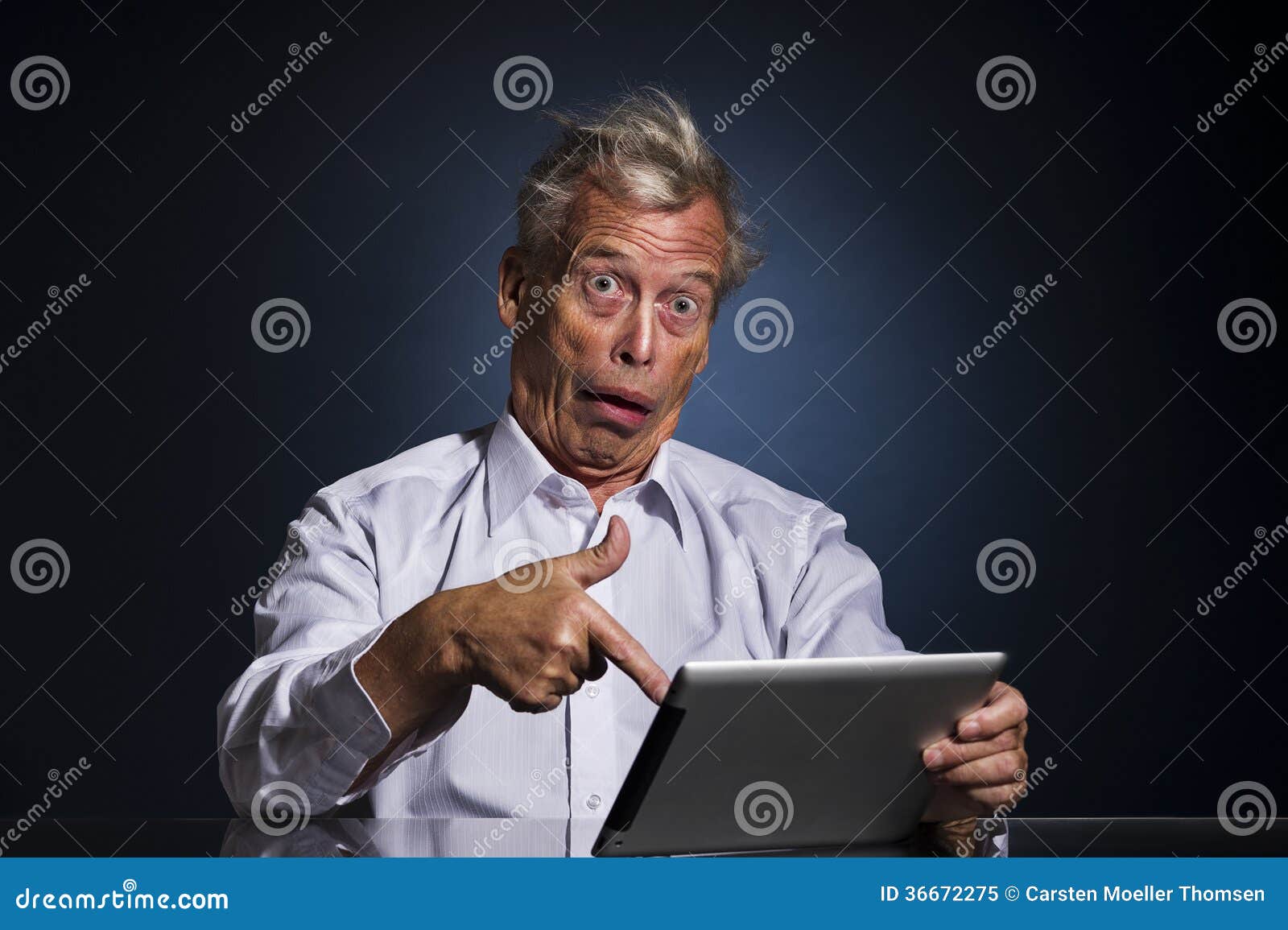 Shocked Senior Man Pointing To His Tablet Royalty-Free Stock ... Shocked Senior Man Pointing To His Tablet Royalty-Free Stock ...