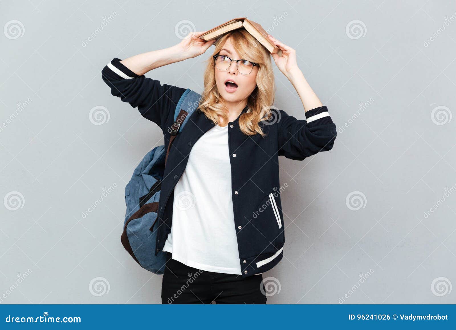 Shocked student with book stock photo. Image of eyeglasses - 96241026