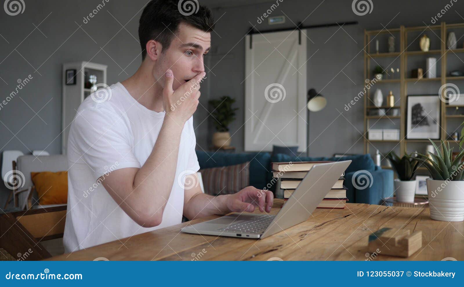 Shocked Stunned Man Wondering And Working On Laptop Stock Image