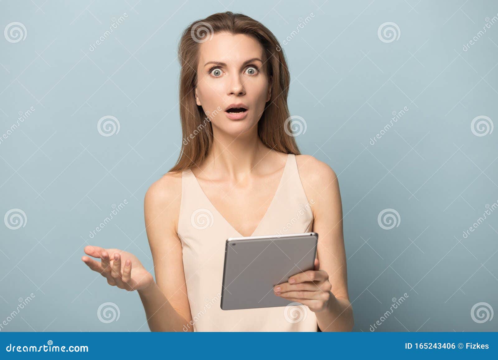 Shocked Surprised Woman Looking at Camera, Using Tablet Computer Stock ... Shocked Surprised Woman Looking at Camera, Using Tablet Computer Stock ...