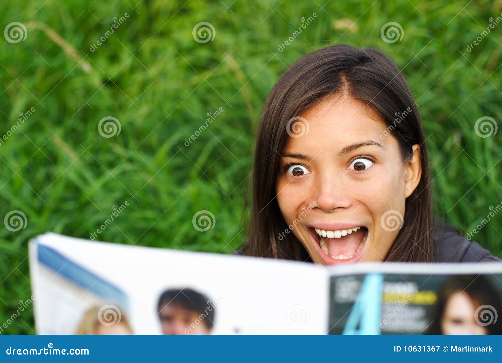 Shocked Woman Reading Magazine Stock Image - Image of grass, asian ...
