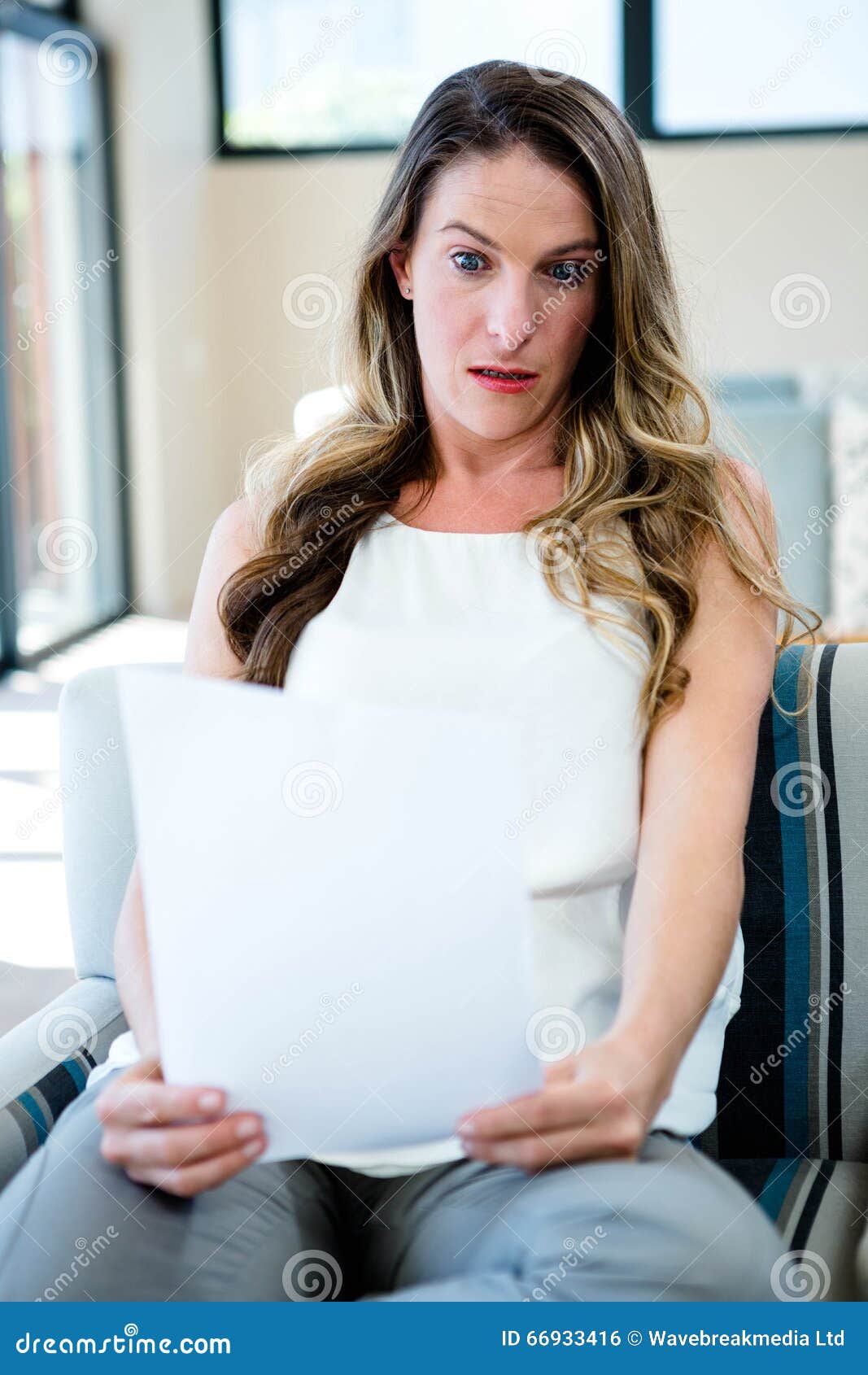 Shocked Woman Reading Papers Stock Photo - Image of surprised ...
