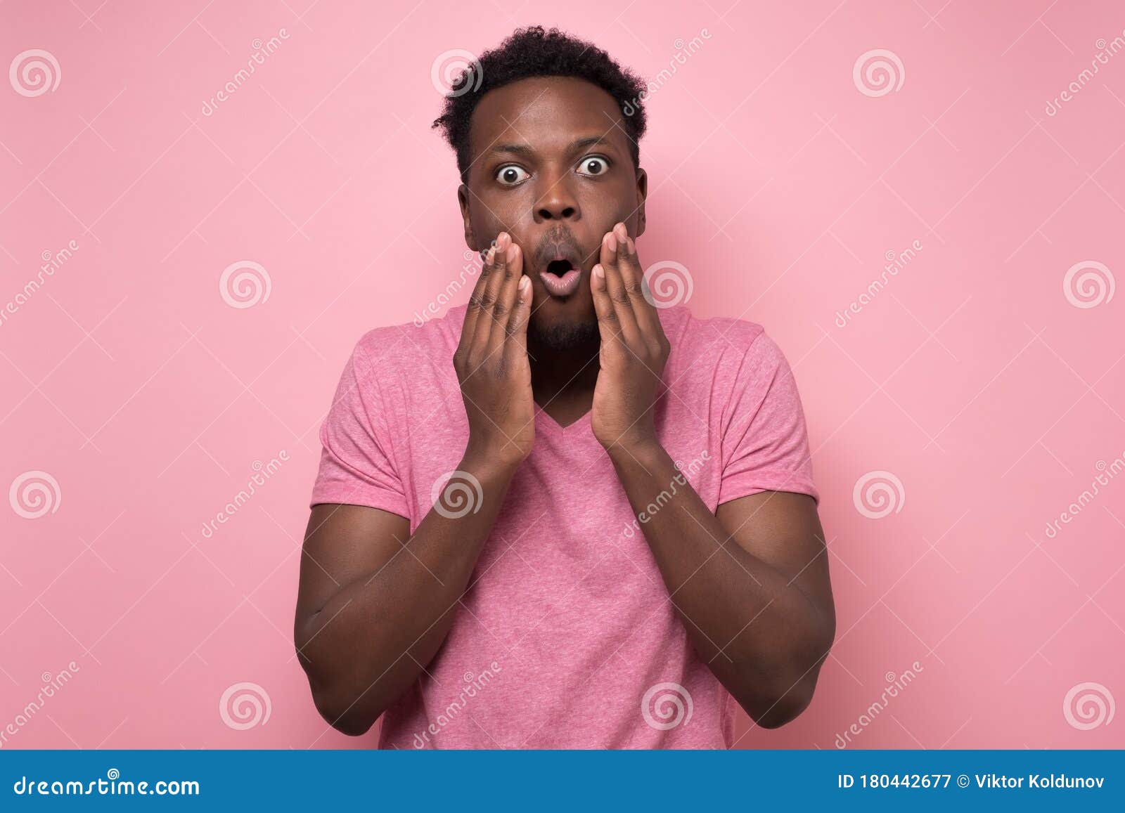 African American Man Looking At The Camera In Surprise Stunned With A