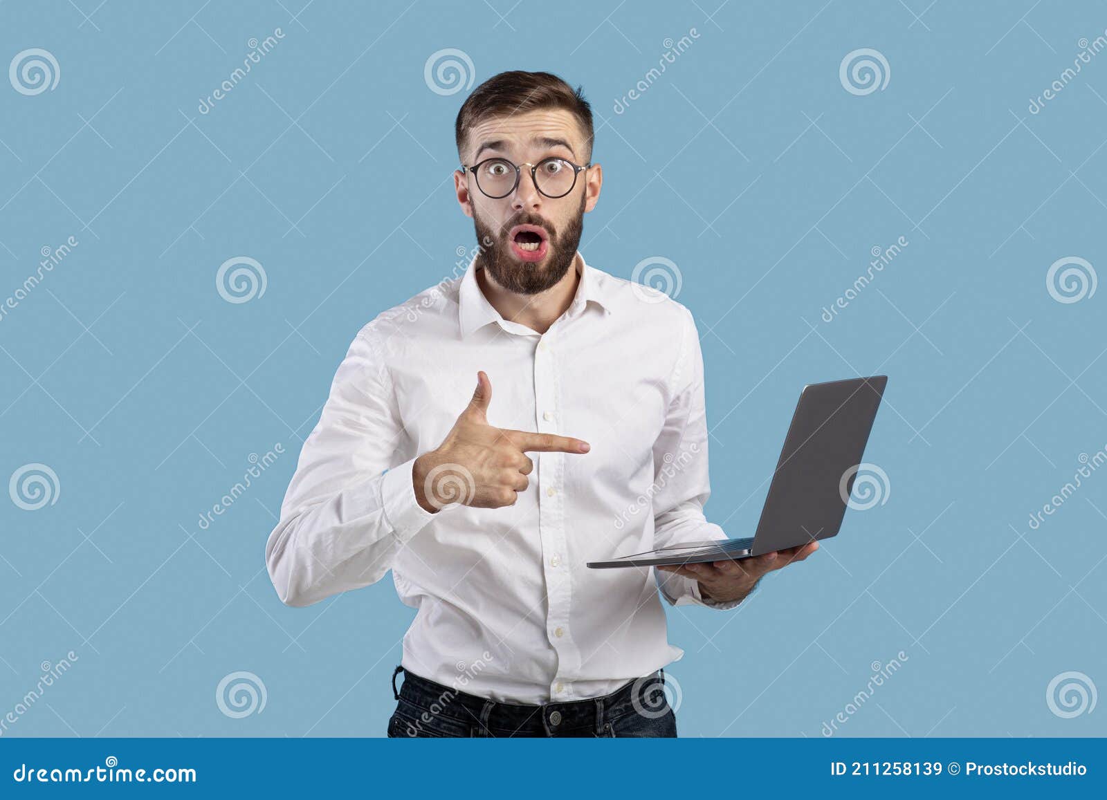 Shocked Young Man Pointing at Laptop Computer with Open Mouth ...