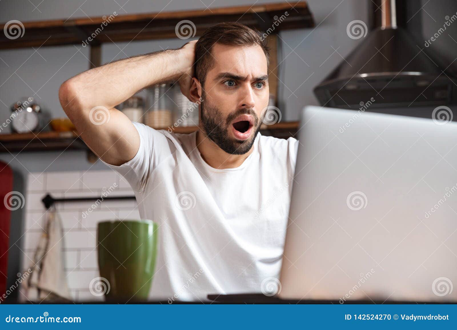 Shocked Young Man Using Laptop Computer Stock Photo - Image of shopping ...