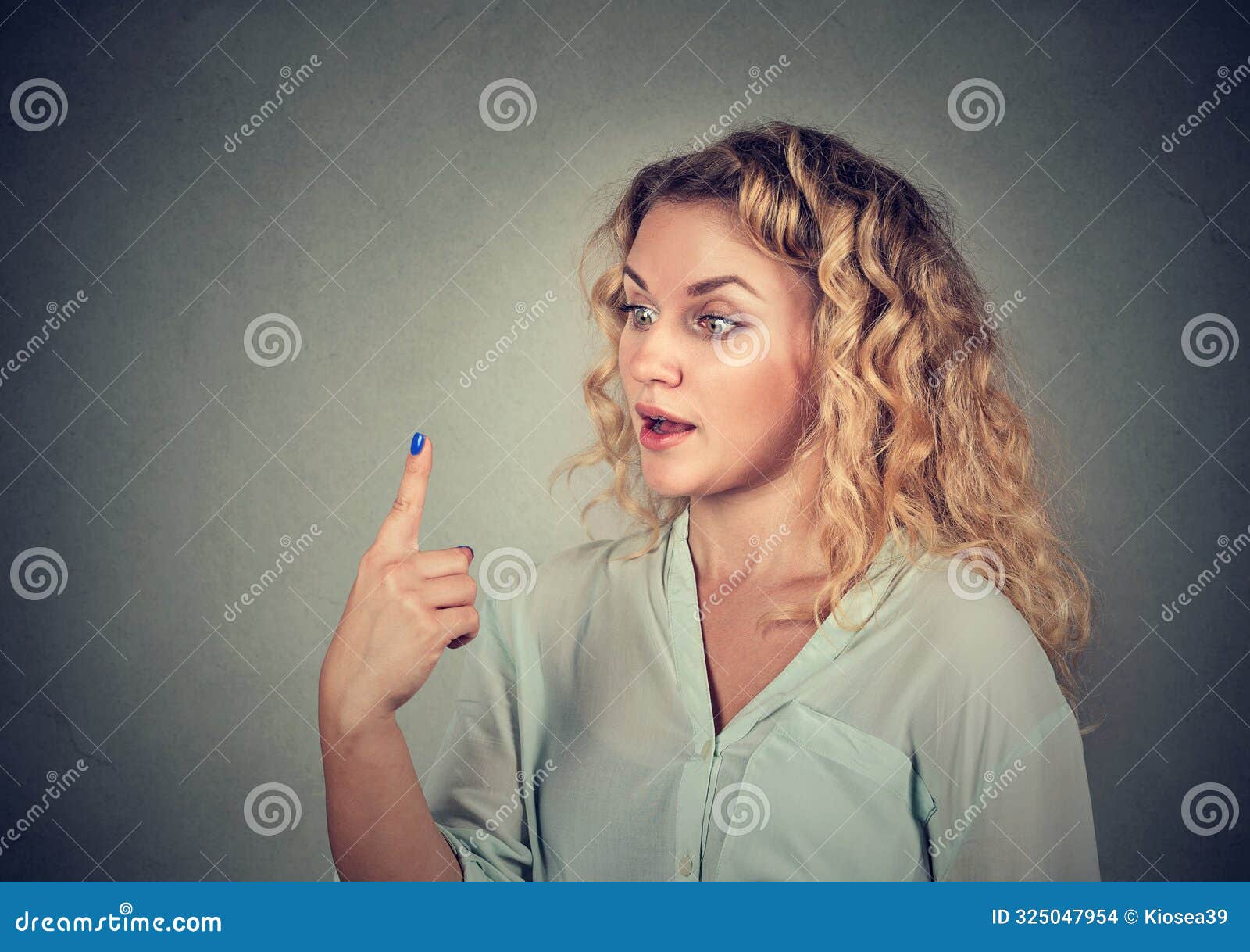 Shocked Young Woman Looking at Her Index Finger Stock Photo - Image of ...