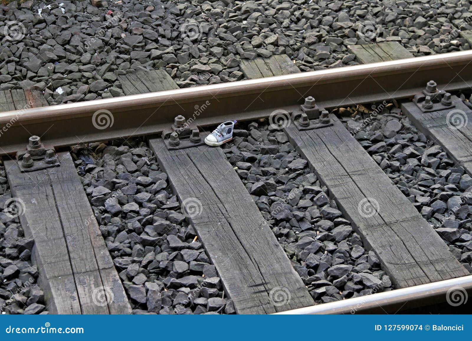 Shoe at Rail Tracks stock photo. Image of footwear, railroad - 127599074