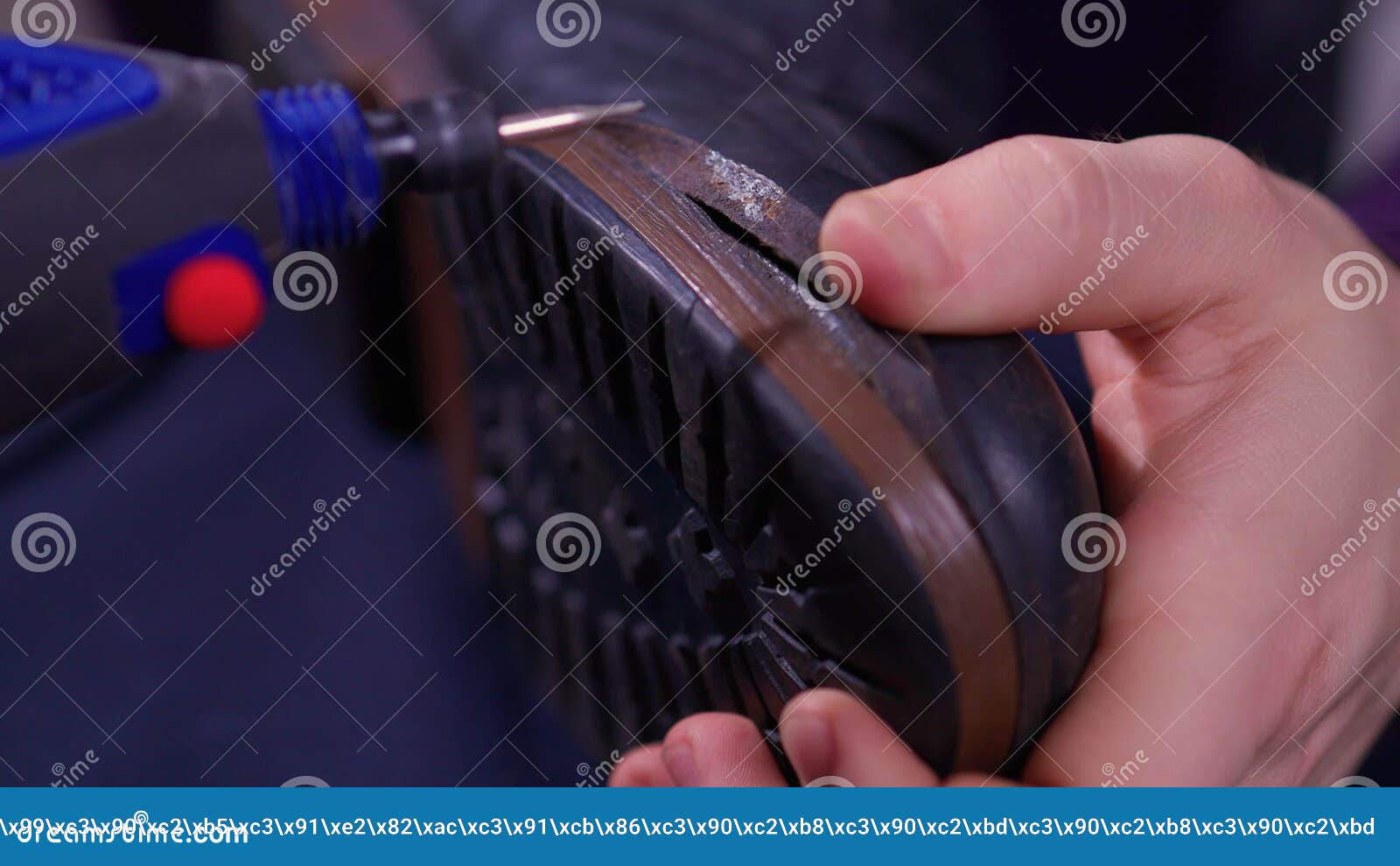 A Shoemaker Cuts the Sole of a Shoe with a Shoemaker S Automatic Cutter ...