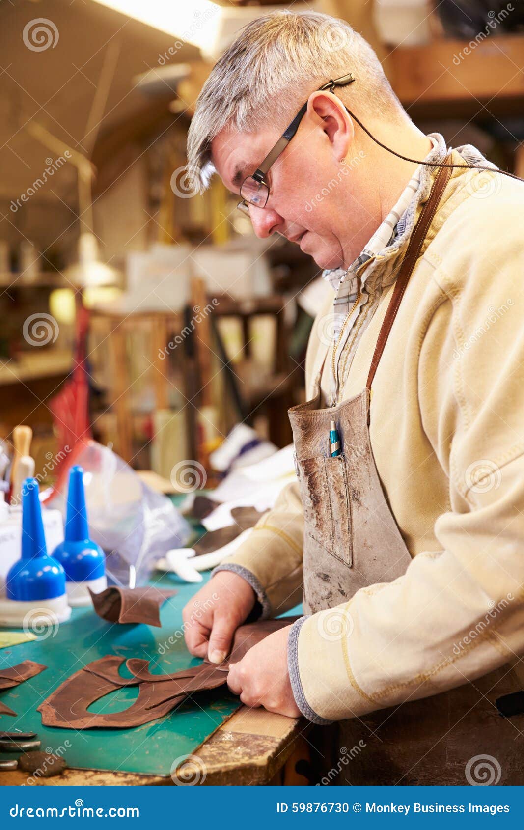 Shoemaker Cutting and Gluing Leather in a Workshop Stock Photo - Image ...