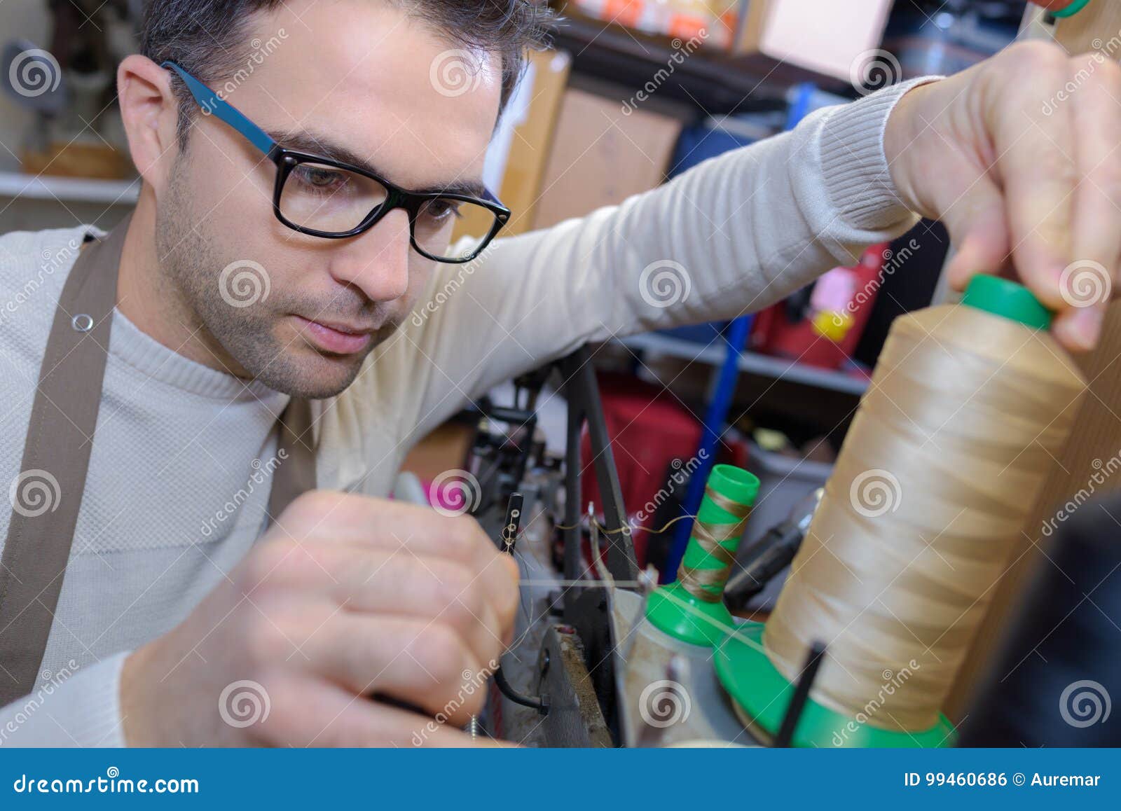 Shoemaker Putting Thread in Needle in Workshop Stock Photo - Image of ...
