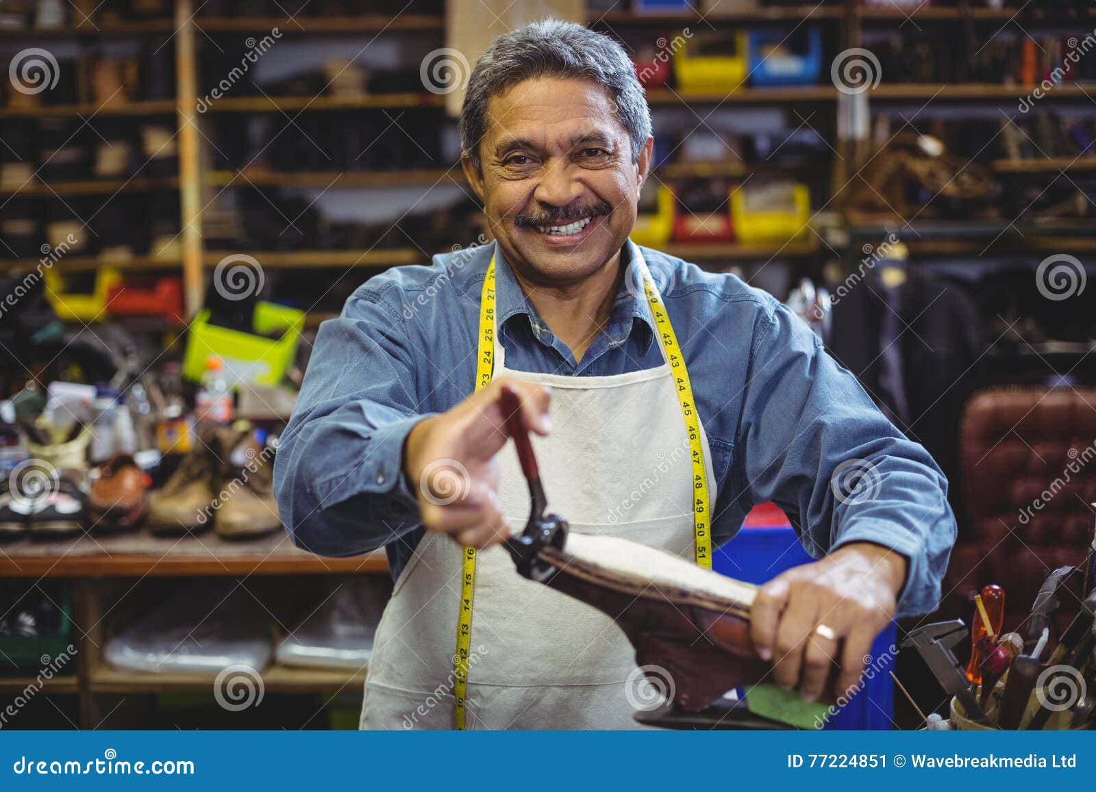 Shoemaker repairing a shoe stock image. Image of camera - 77224851