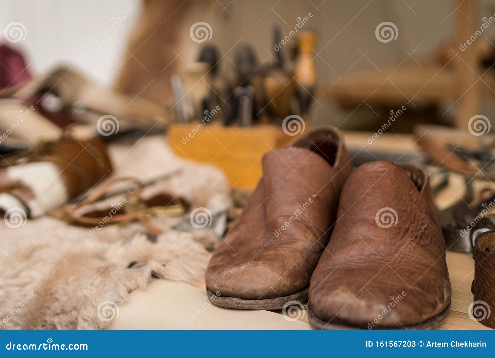 Shoemaker Working Desk with Focus on Ready Shoes Foreground and Set of ...