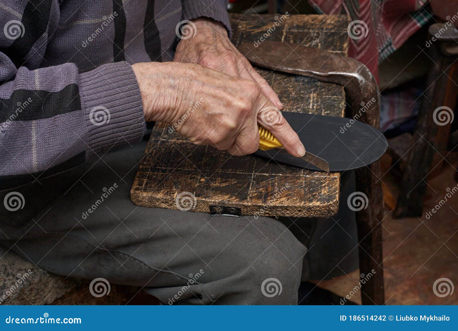 The Shoemaker is Working. Knives Rubber. Shoemaker Retired Stock Photo ...
