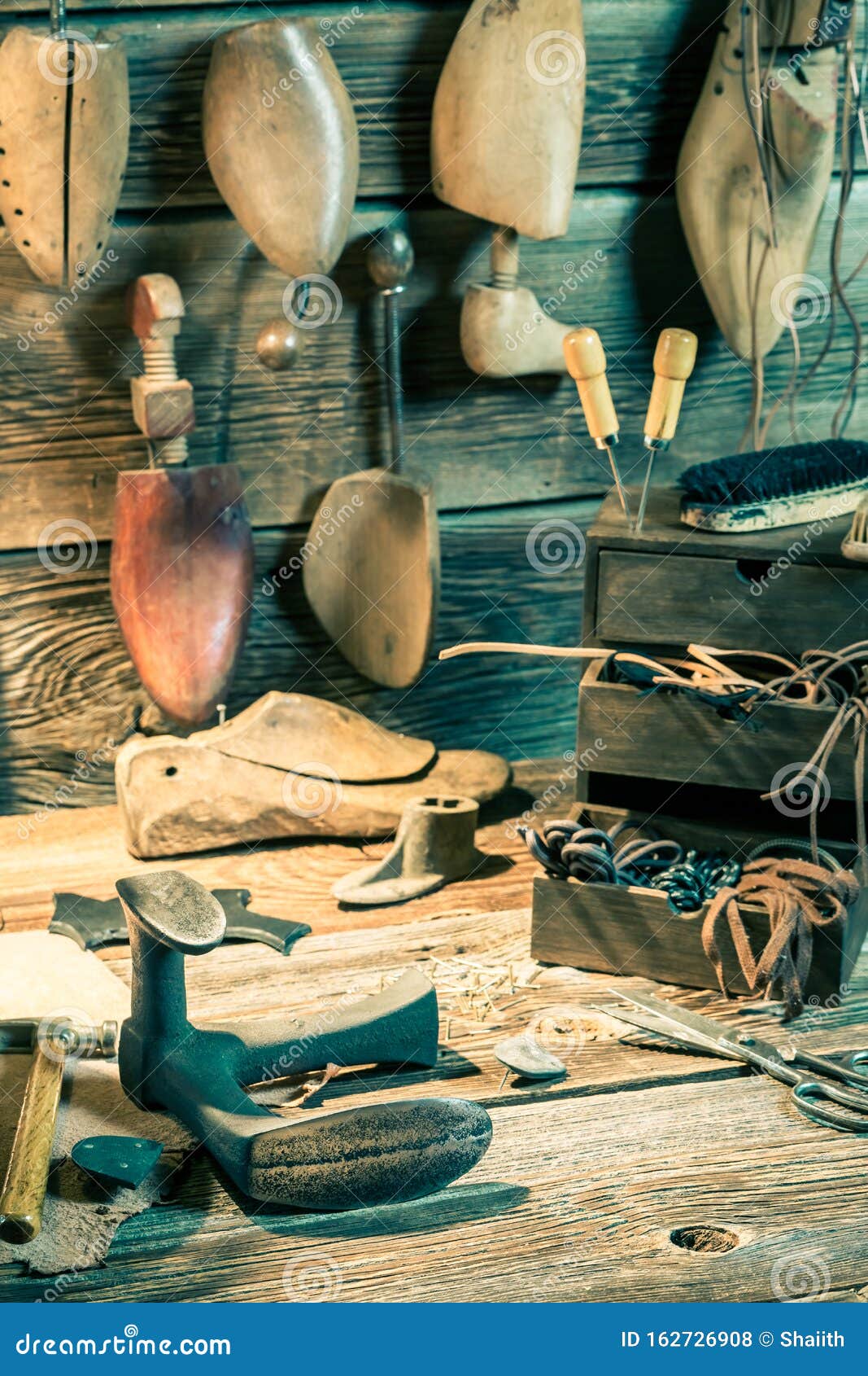 Shoemaker Workplace with Tools, Leather and Shoes To Repair Stock Photo ...