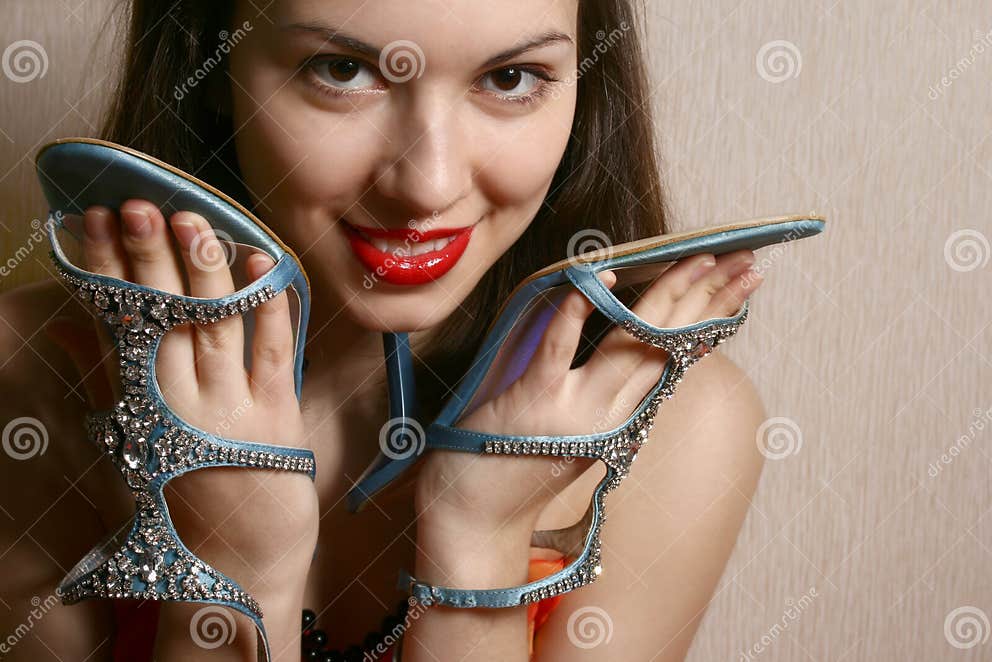 Shoes on hands. stock photo. Image of brunette, looking - 8263936
