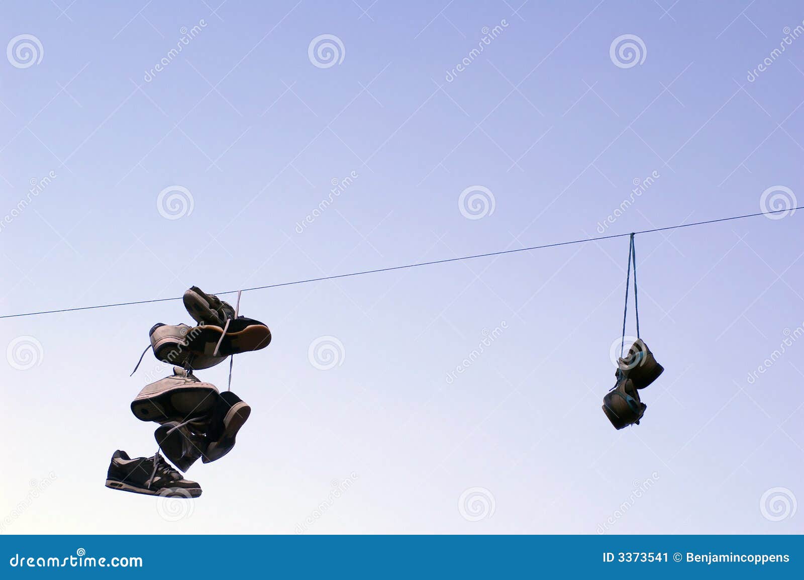 Shoes hanging on a cable stock image. Image of hanging - 3373541