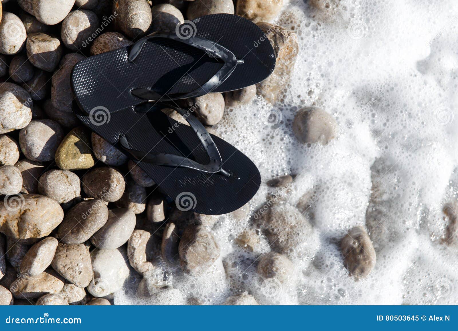 Shoes, Pebbles on Sea Water Stock Image - Image of pebble, nature: 80503645