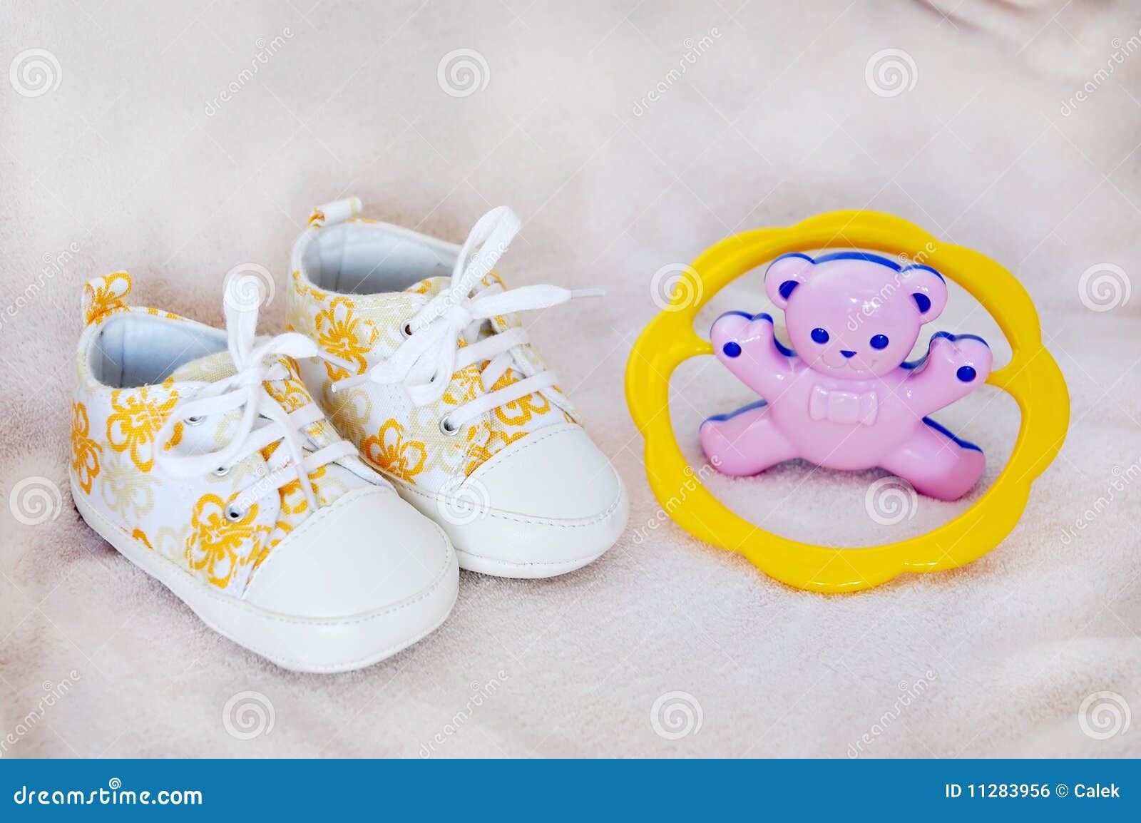 Shoes and rattle stock photo. Image of booty, background - 11283956