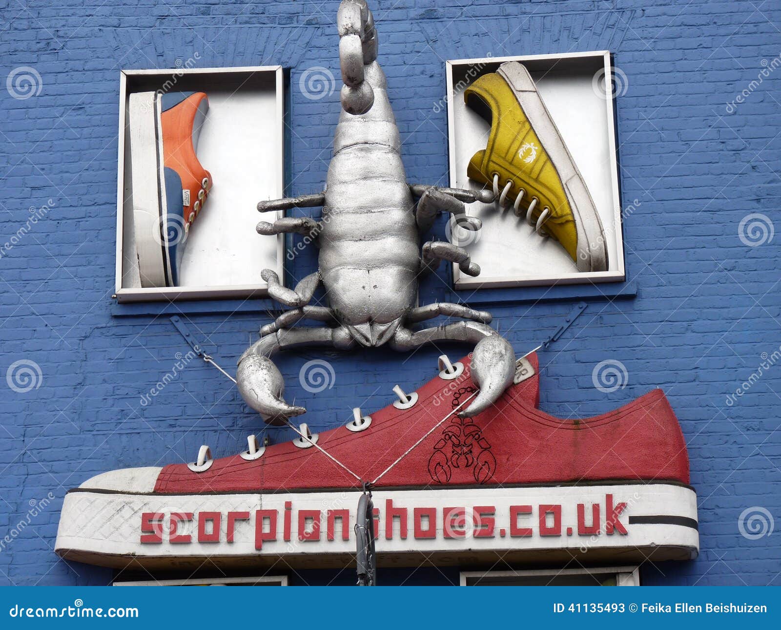 Shoes and a Scorpio on a Blue Wall Editorial Stock Photo - Image of ...