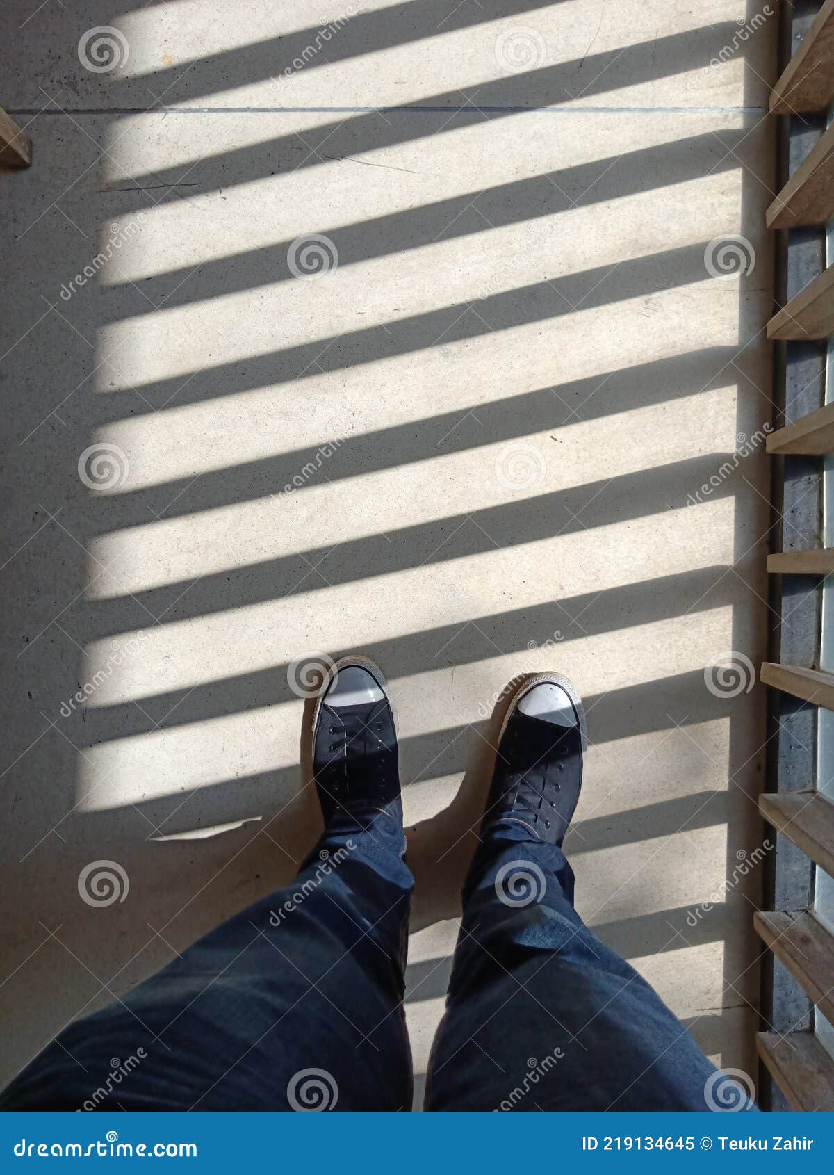 Shoes in the shadow stock image. Image of striped, shadow - 219134645