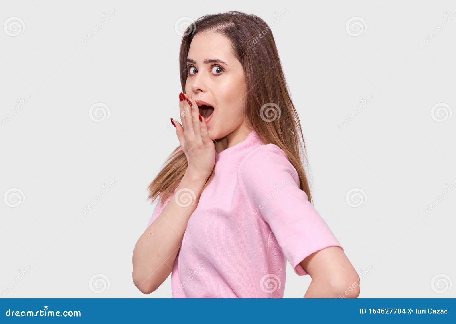 Shoked Young Woman Has Amazed Expression Wearing Pink Shirt Portrait