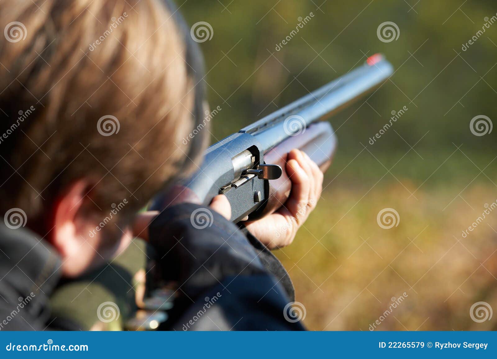 Shooter takes aim for shot stock image. Image of power - 22265579