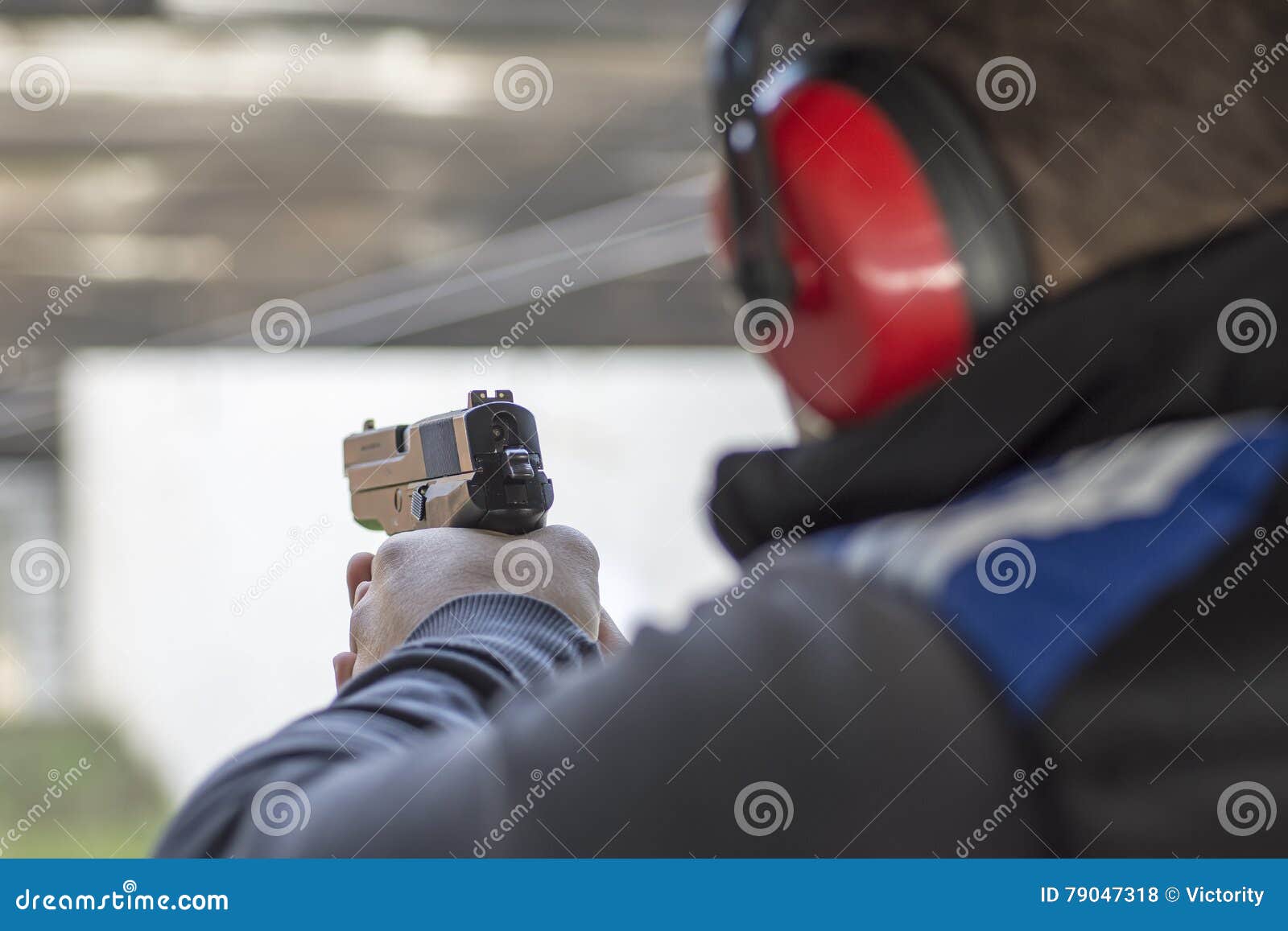 Shooting with Gun at Target in Shooting Range. Man Practicing Fire ... Shooting with Gun at Target in Shooting Range. Man Practicing Fire ...