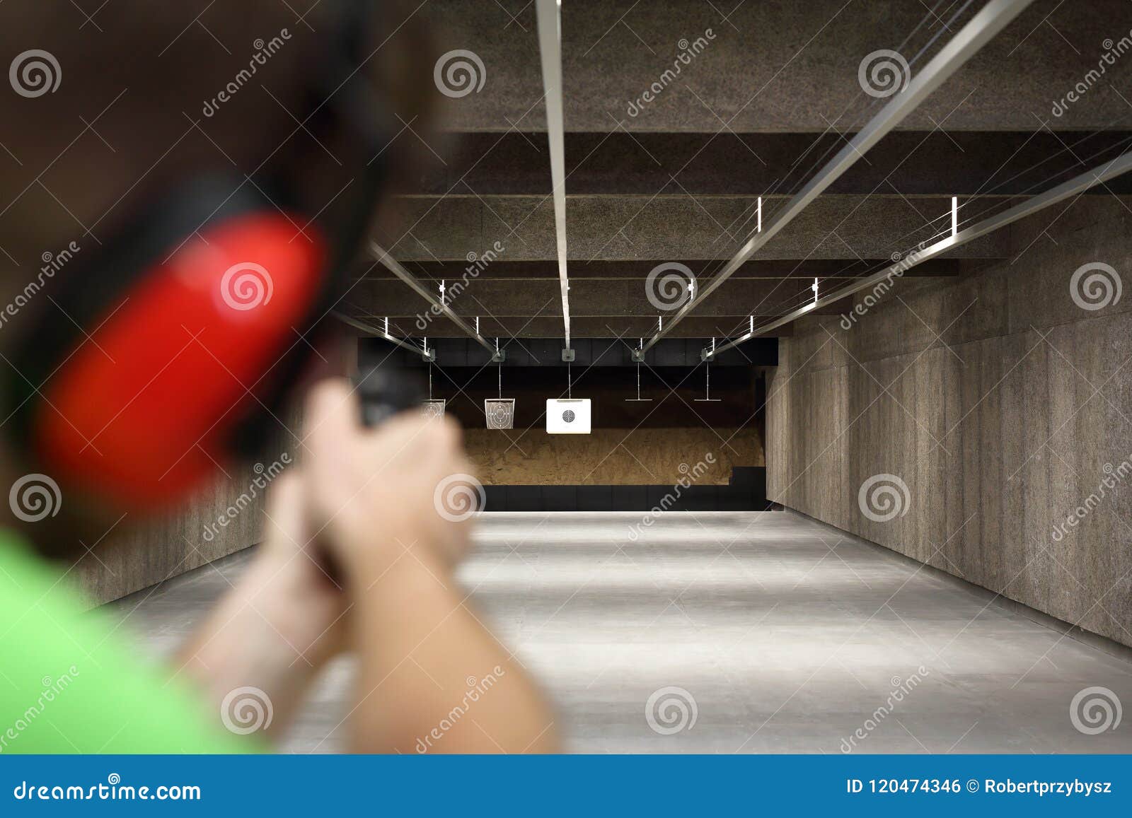 Shooting Range. Rear View Of Men Shooting With Gun In Shooting Range ...