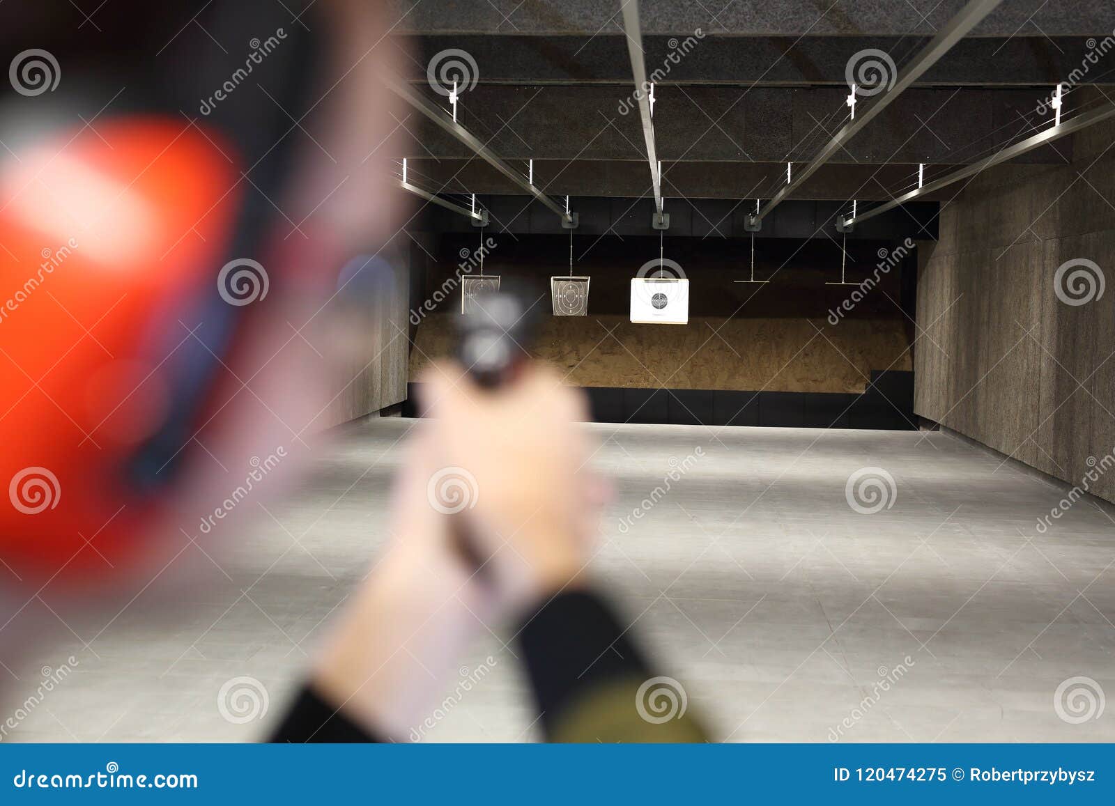 Shooting Range. Rear View Of Men Shooting With Gun In Shooting Range ...