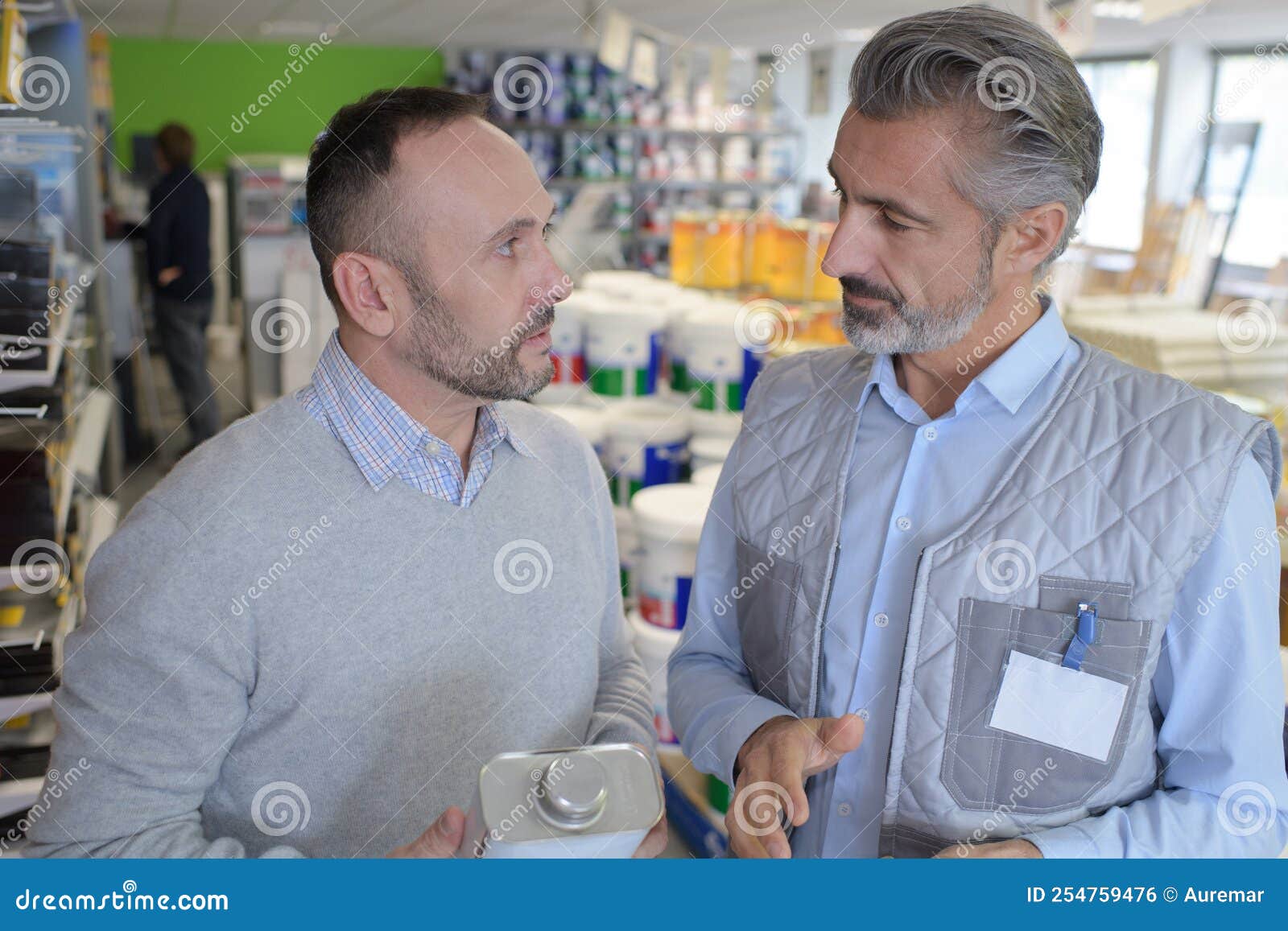 Shop Assistant Giving Advice To Customer in Hardware Store Stock Photo ...
