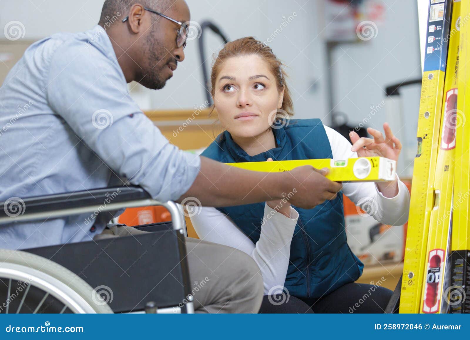 Shop Assistant and Handicaped Man in Hardware Store Stock Photo - Image ...