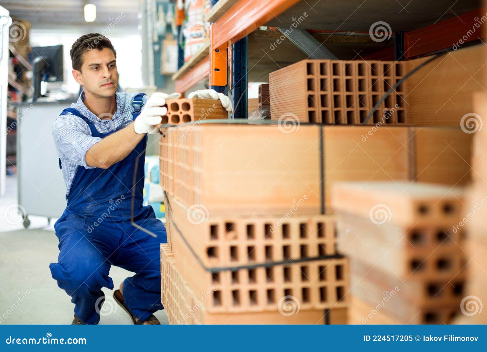 Shop Assistant Man is Checking Quality of Bricks Stock Image - Image of ...