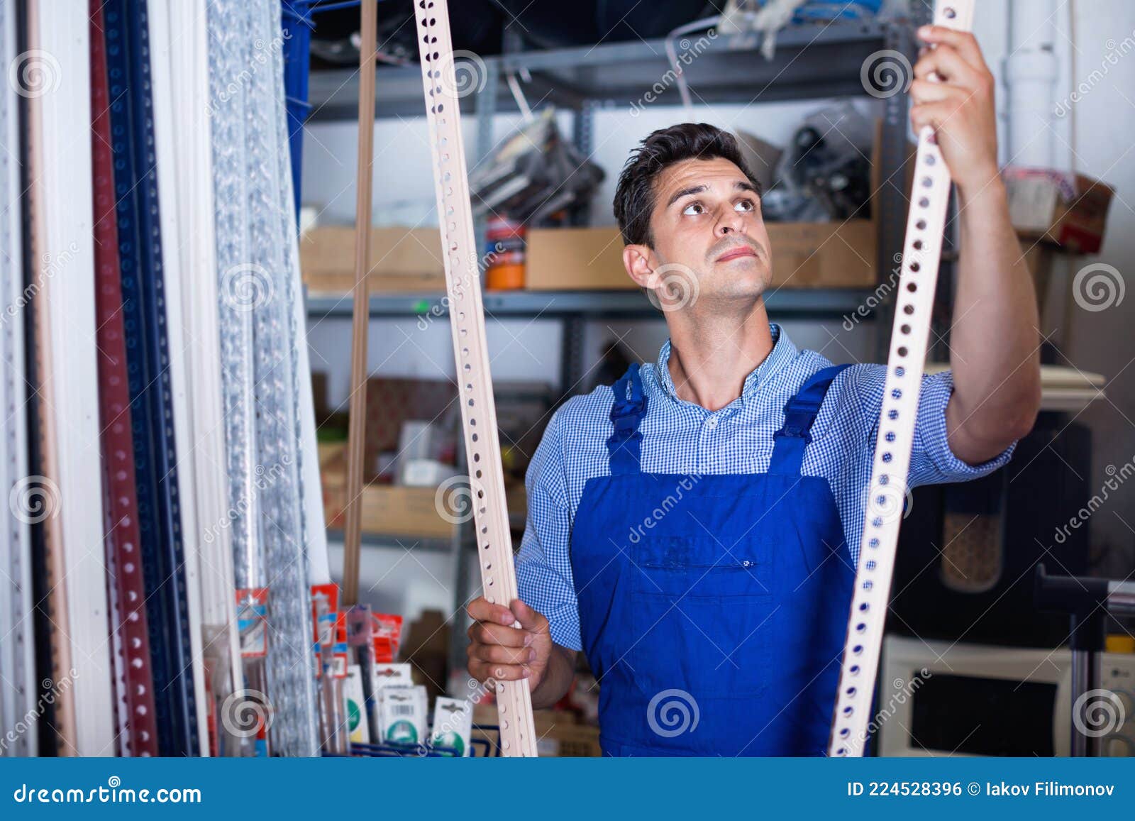 Shop Assistant Man is Choosing Ceiling for Client in Store. Stock Photo ...