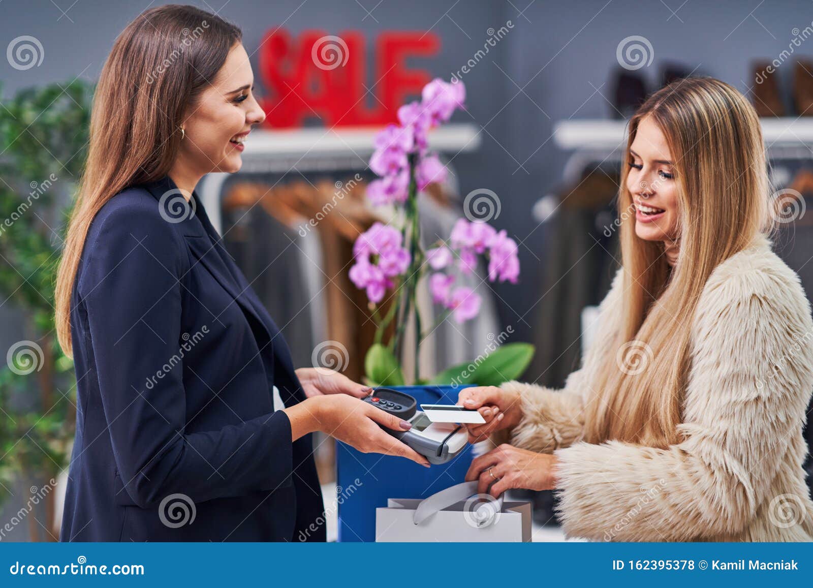 Shop Assistant Serving the Customer in Store Stock Photo - Image of ...