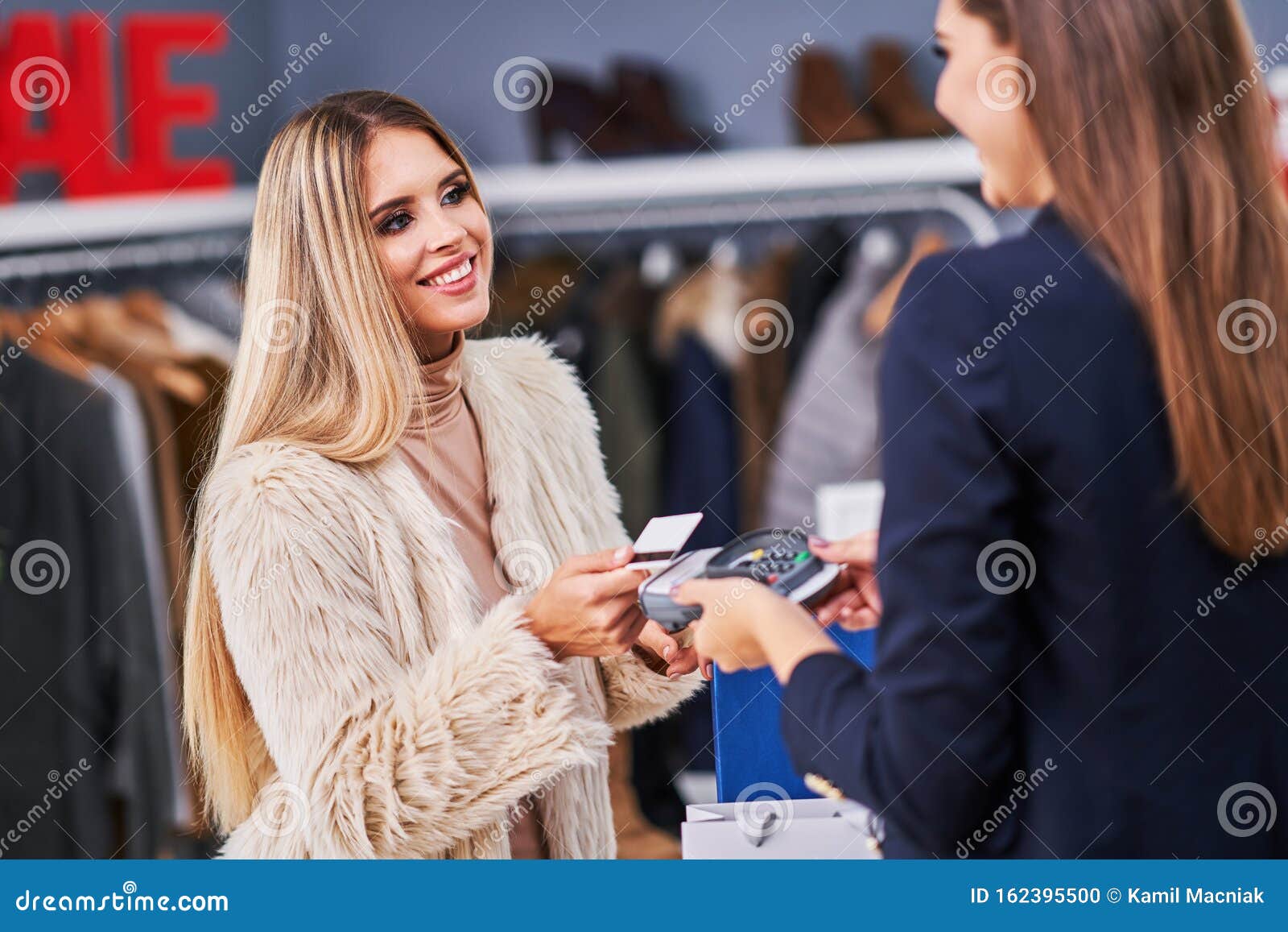Shop Assistant Serving the Customer in Store Stock Photo - Image of ...