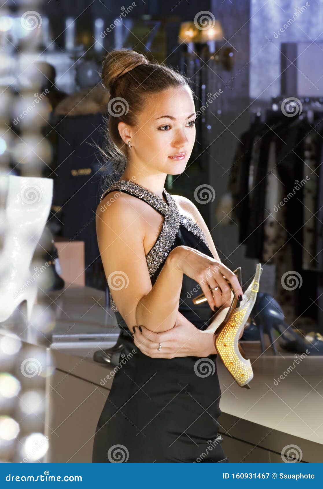 Shop Assistant with Shoe in a Boutique Stock Image - Image of ...