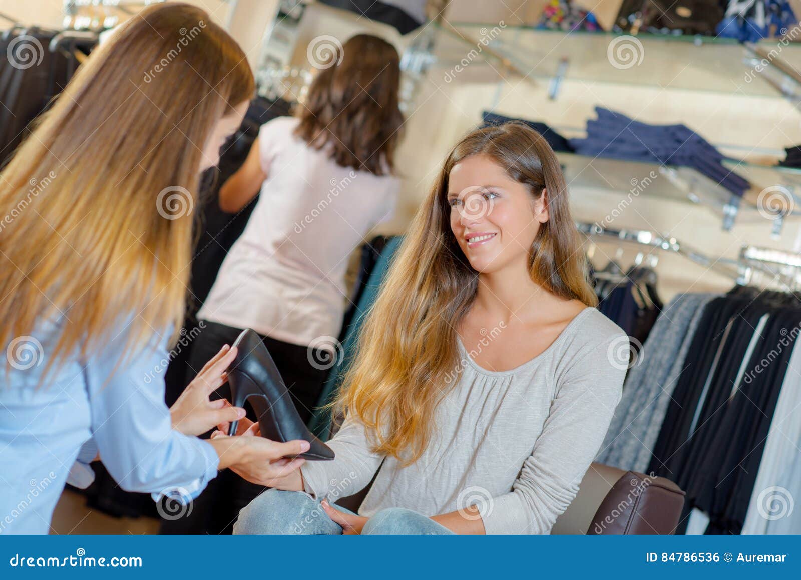 Shop Assistant Showing Customer Shoe Stock Photo - Image of elegant ...