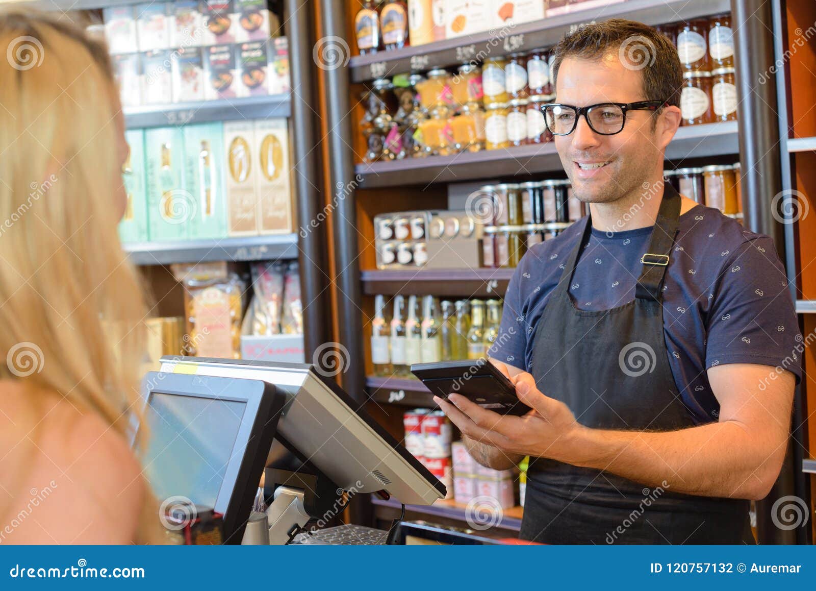 Shop Assistant Using Calculator Stock Photo - Image of food, glasses ...