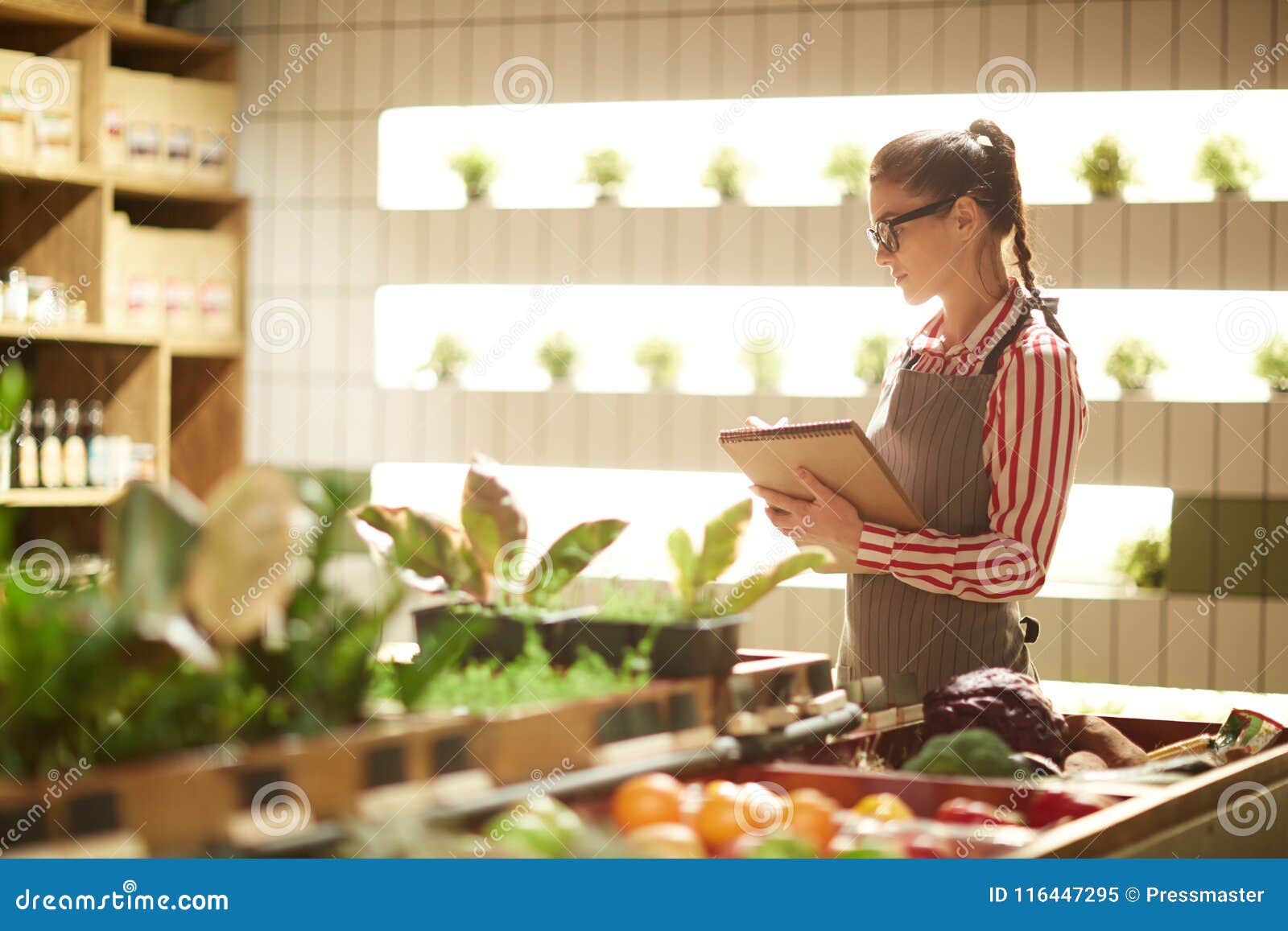 Shop assistant at work stock image. Image of staff, writing - 116447295