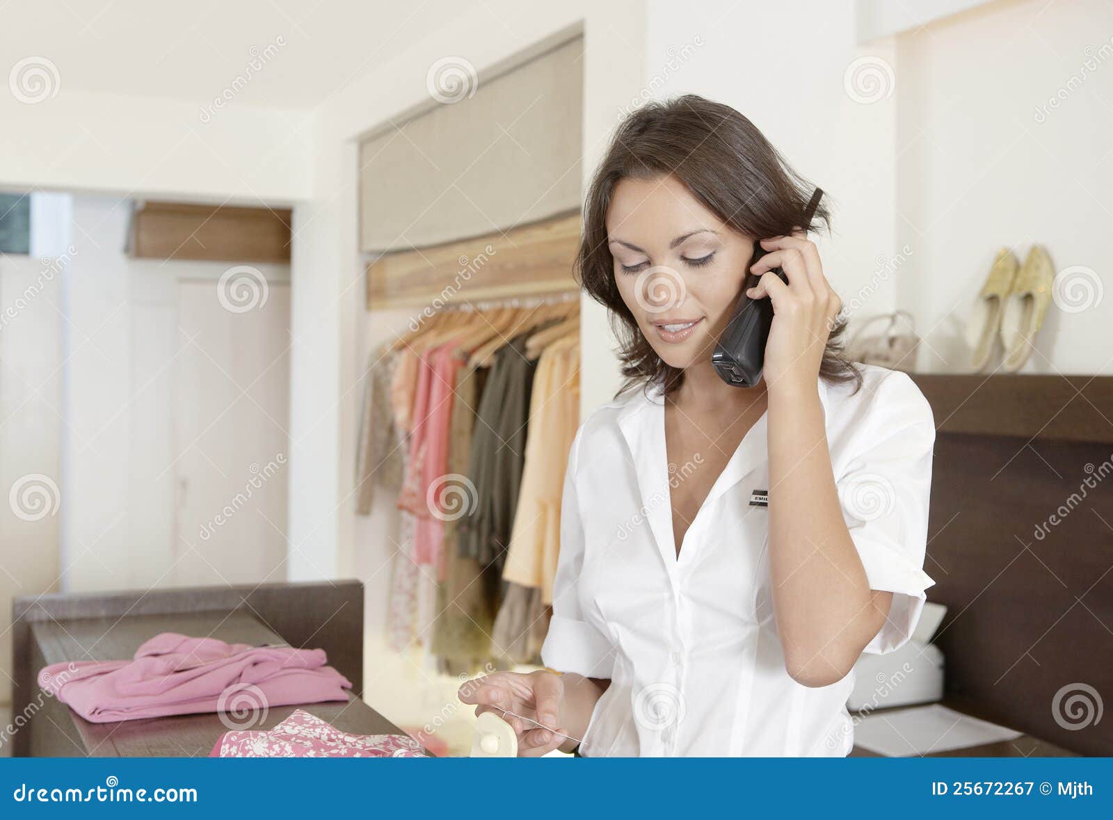 Shop Attendant on Phone stock image. Image of desk, attendant - 25672267