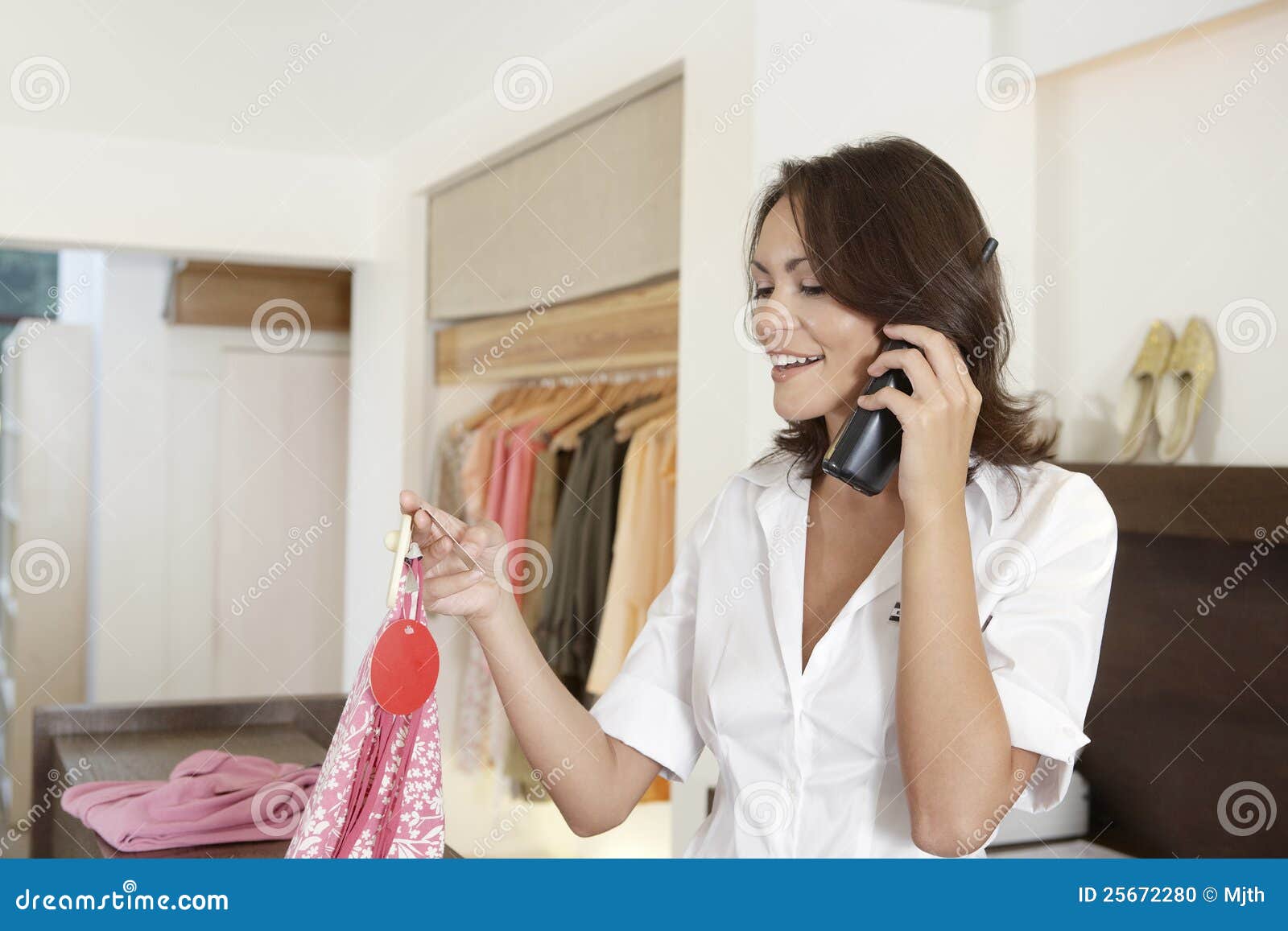 Shop Attendant on Phone stock photo. Image of interior - 25672280